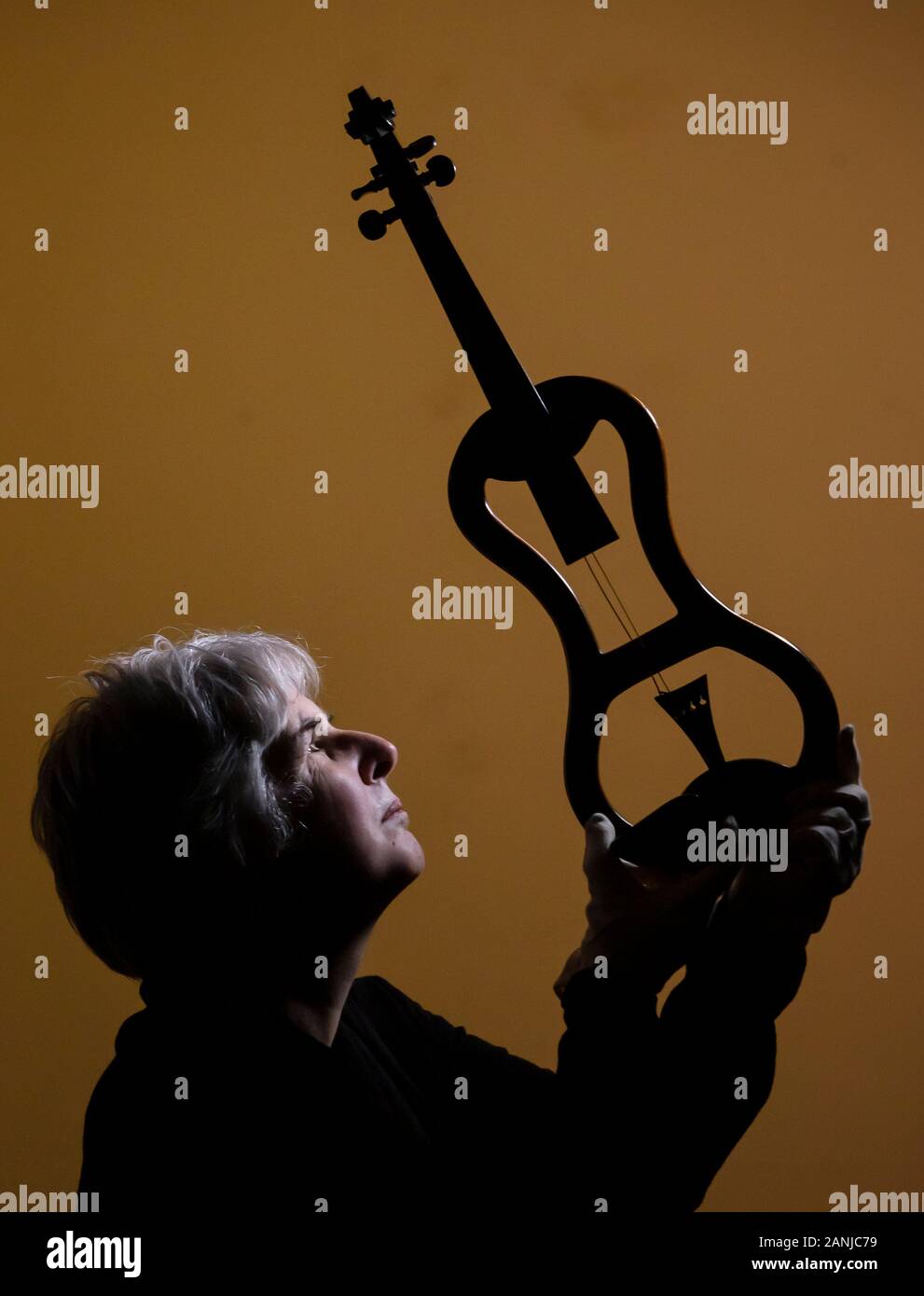 Kitty Ross, curator of social history, holds a skeleton violin from the ...