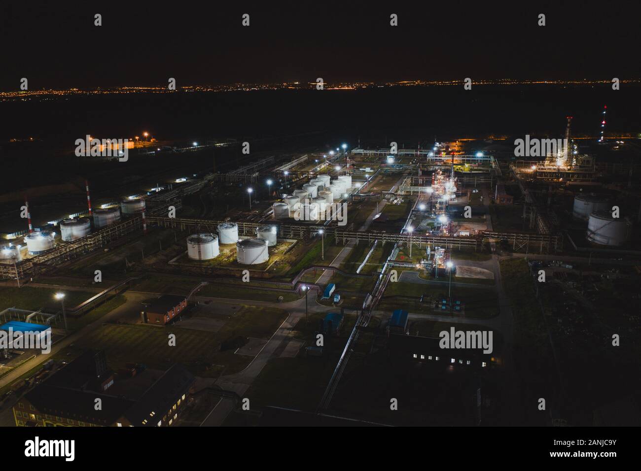 Oil refinery night Stock Photo - Alamy