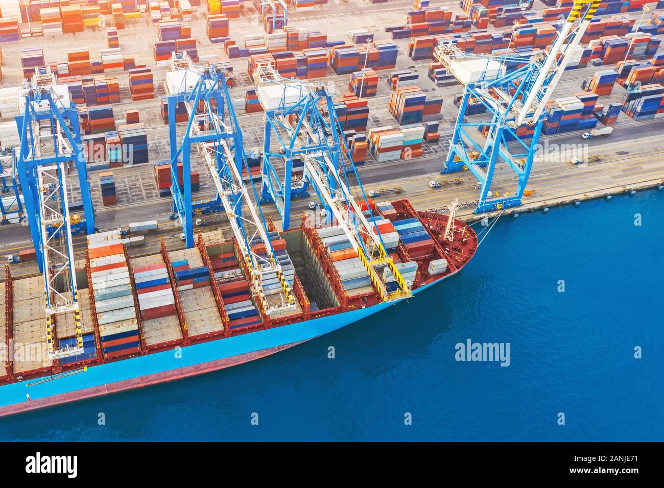 Large container ship in port. front view, unloading loading cargo ...