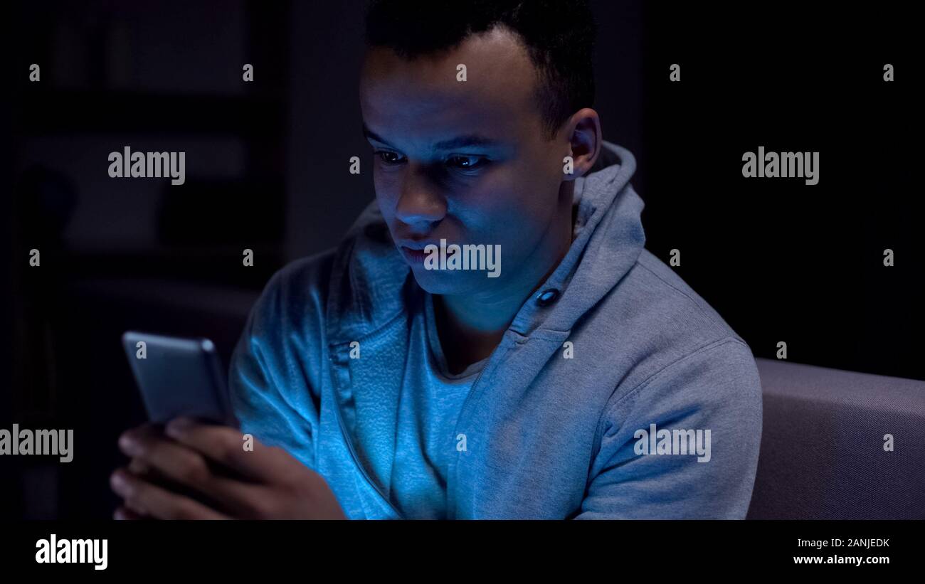 African american scrolling phone hi-res stock photography and images ...