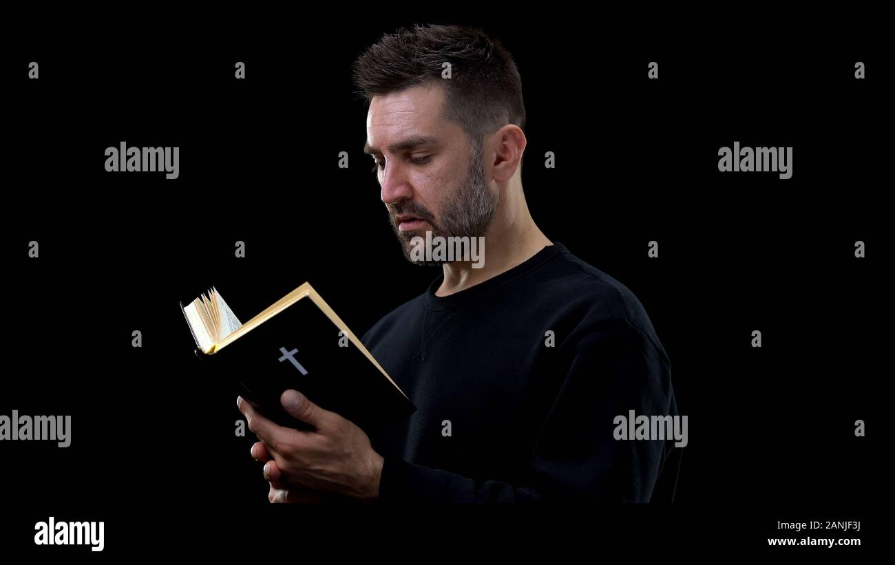Religious believer holding bible, finding answers to questions, faith ...
