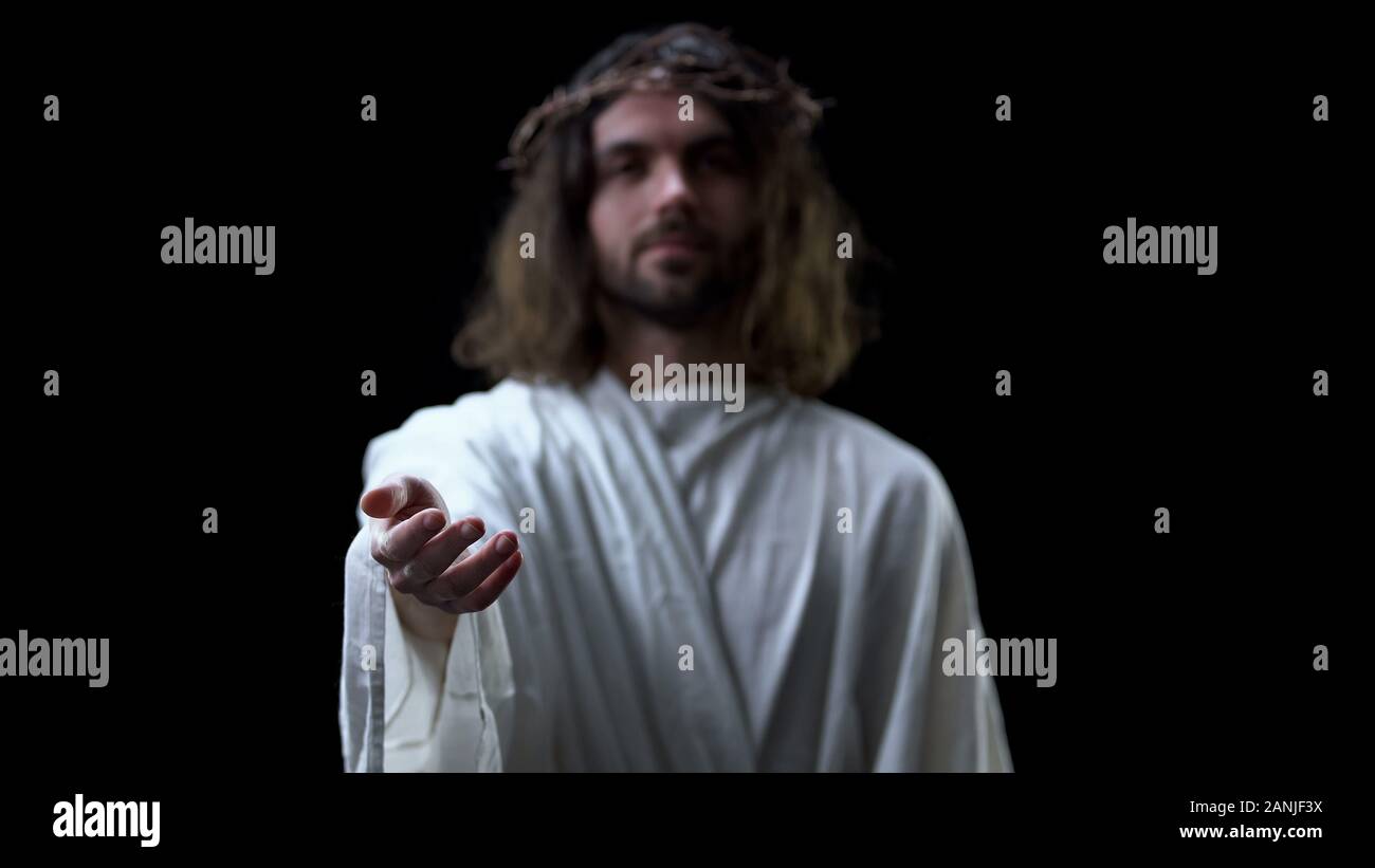 Helping hand of savior on dark background, religious help, forgiveness ...