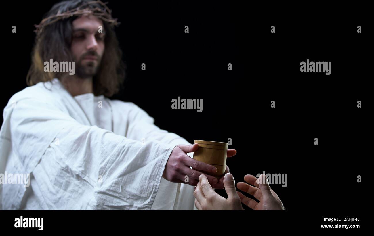 Holy savior giving cup of water poor man, religious mercy, kindness and ...