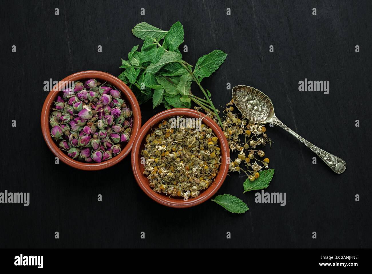 Middle eastern spices / ingredients flat lay on a black background with ...