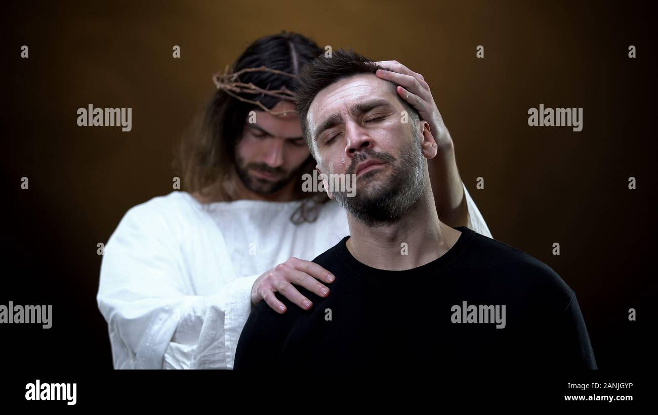 Crying depressed man feeling support of God, spiritual connection ...