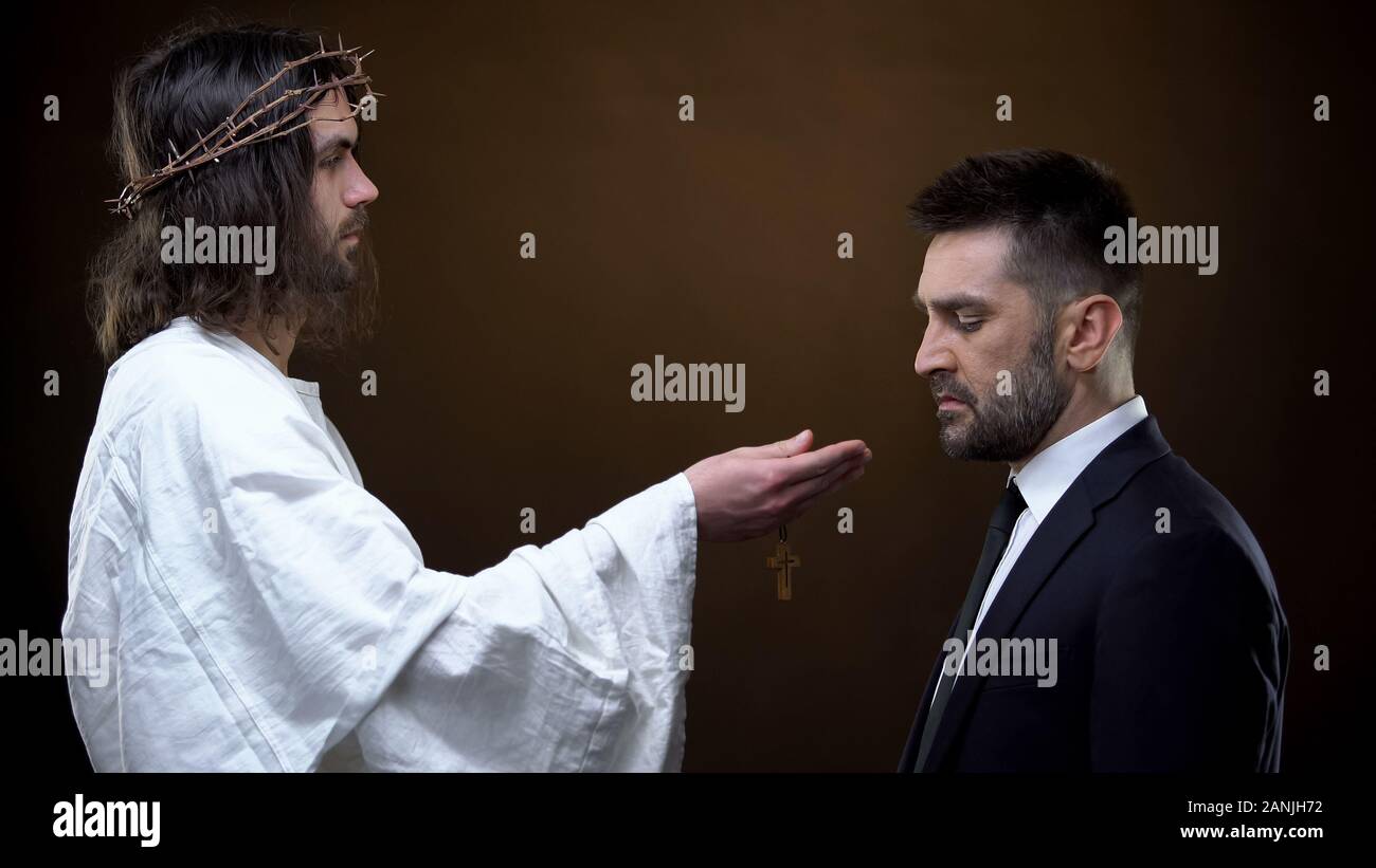 Son god giving wooden cross hi-res stock photography and images - Alamy