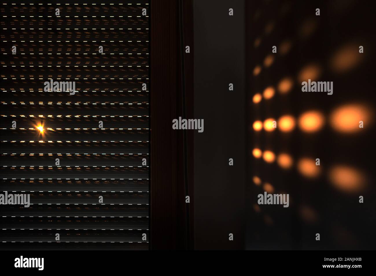 Shutters - blinds with sunlight in the morning. Dark wooden window with ...