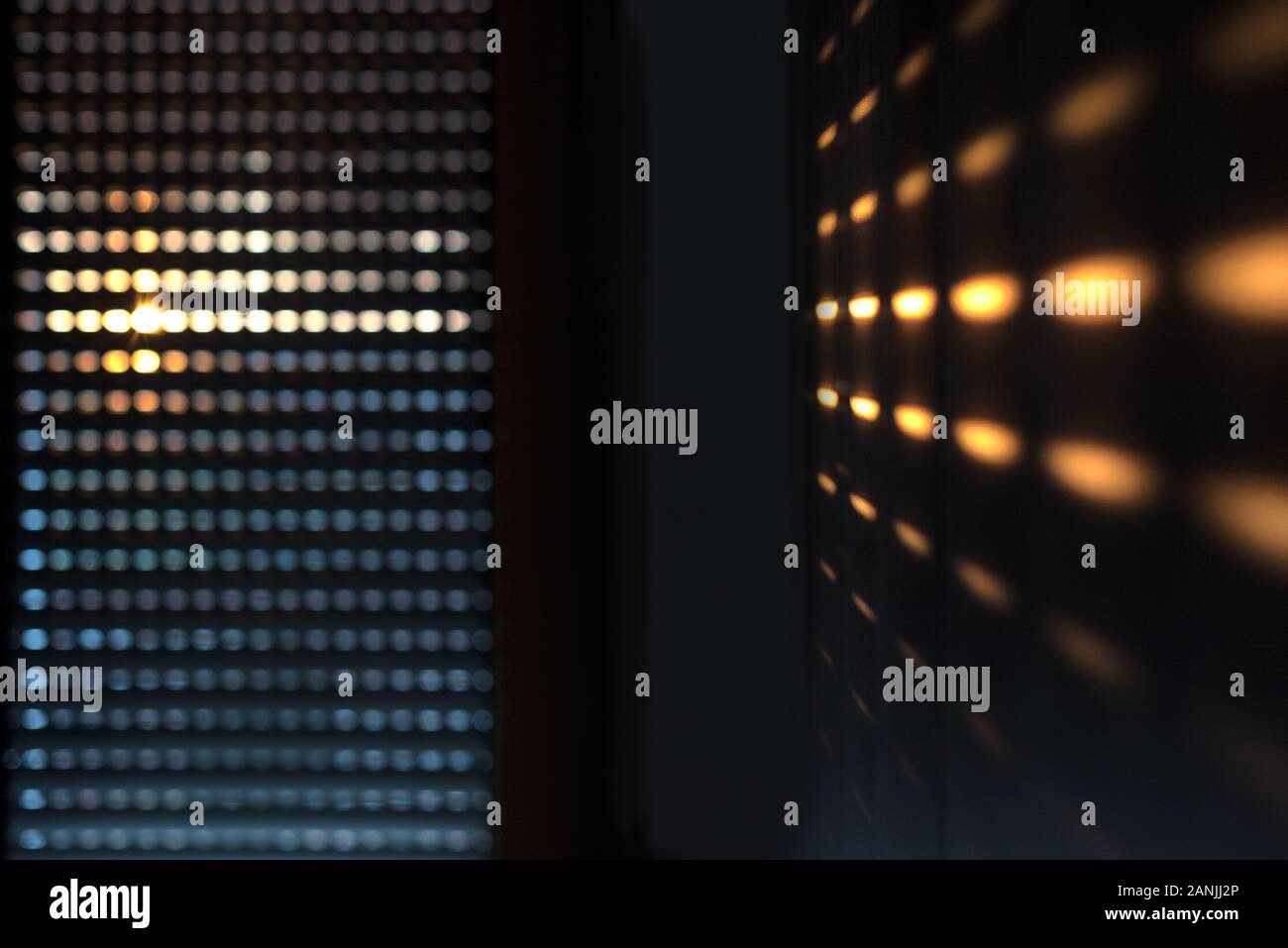 Shutters - blinds with sunlight in the morning. Dark wooden window with ...