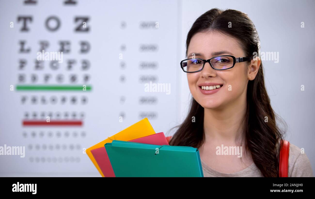 Pretty optometrist smiling camera hi-res stock photography and images ...