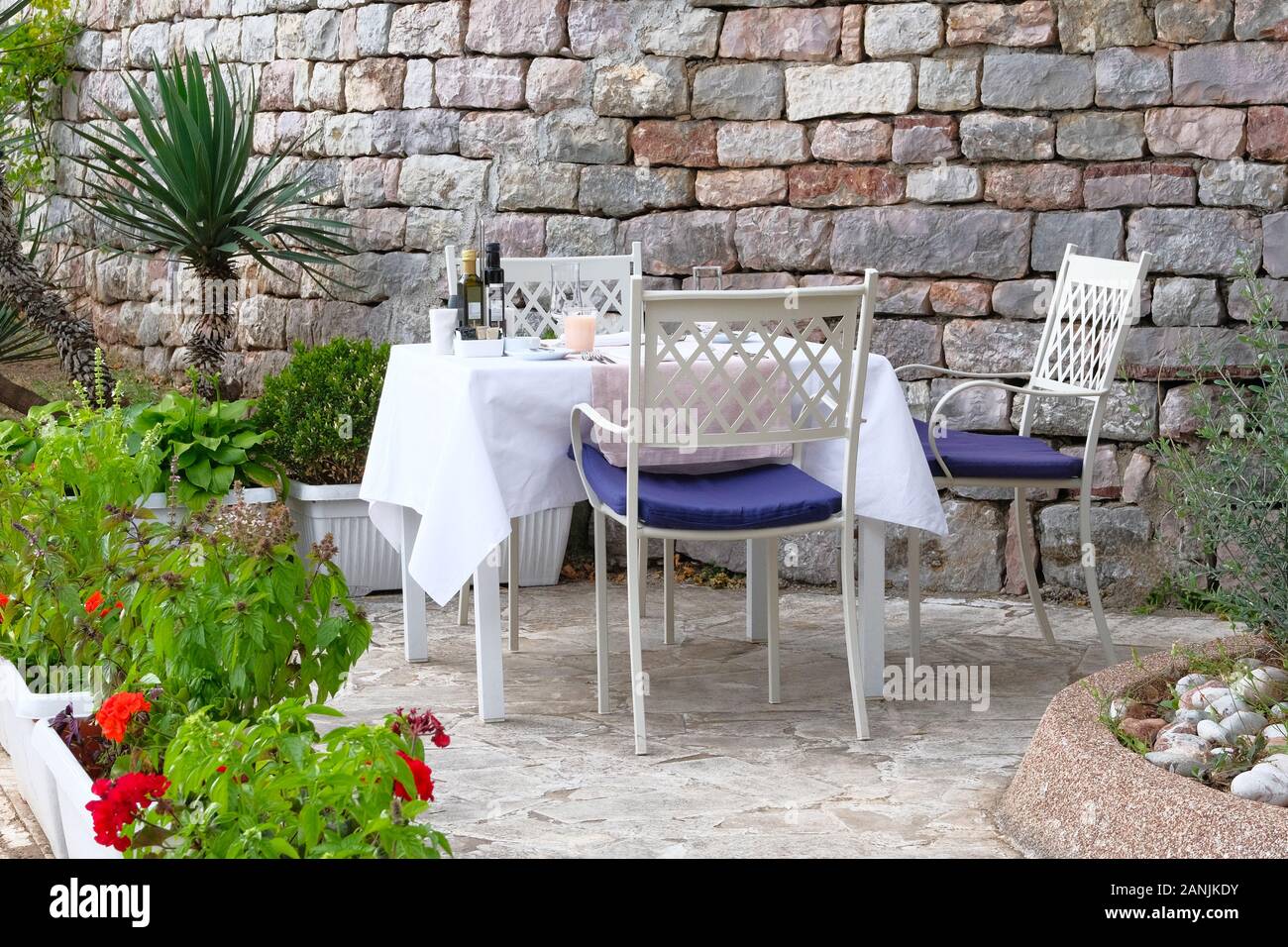 Table is reserved on outdoor summer veranda of european restaurant ...