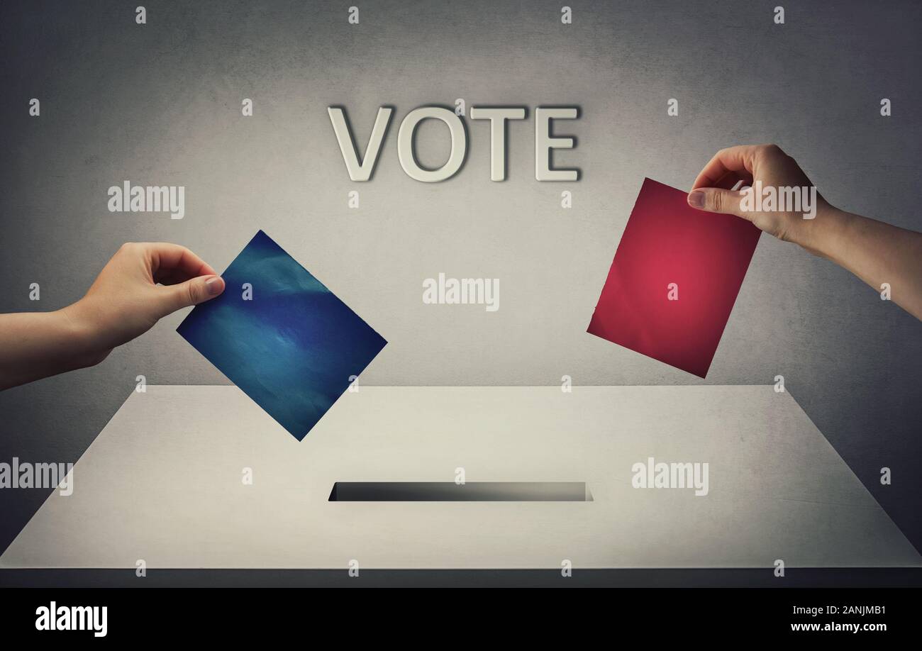 Election concept as two people hands holds different color ballot ...