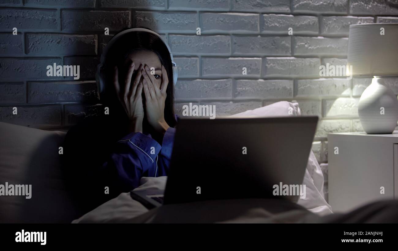 Scared woman alone dark room hi-res stock photography and images - Alamy