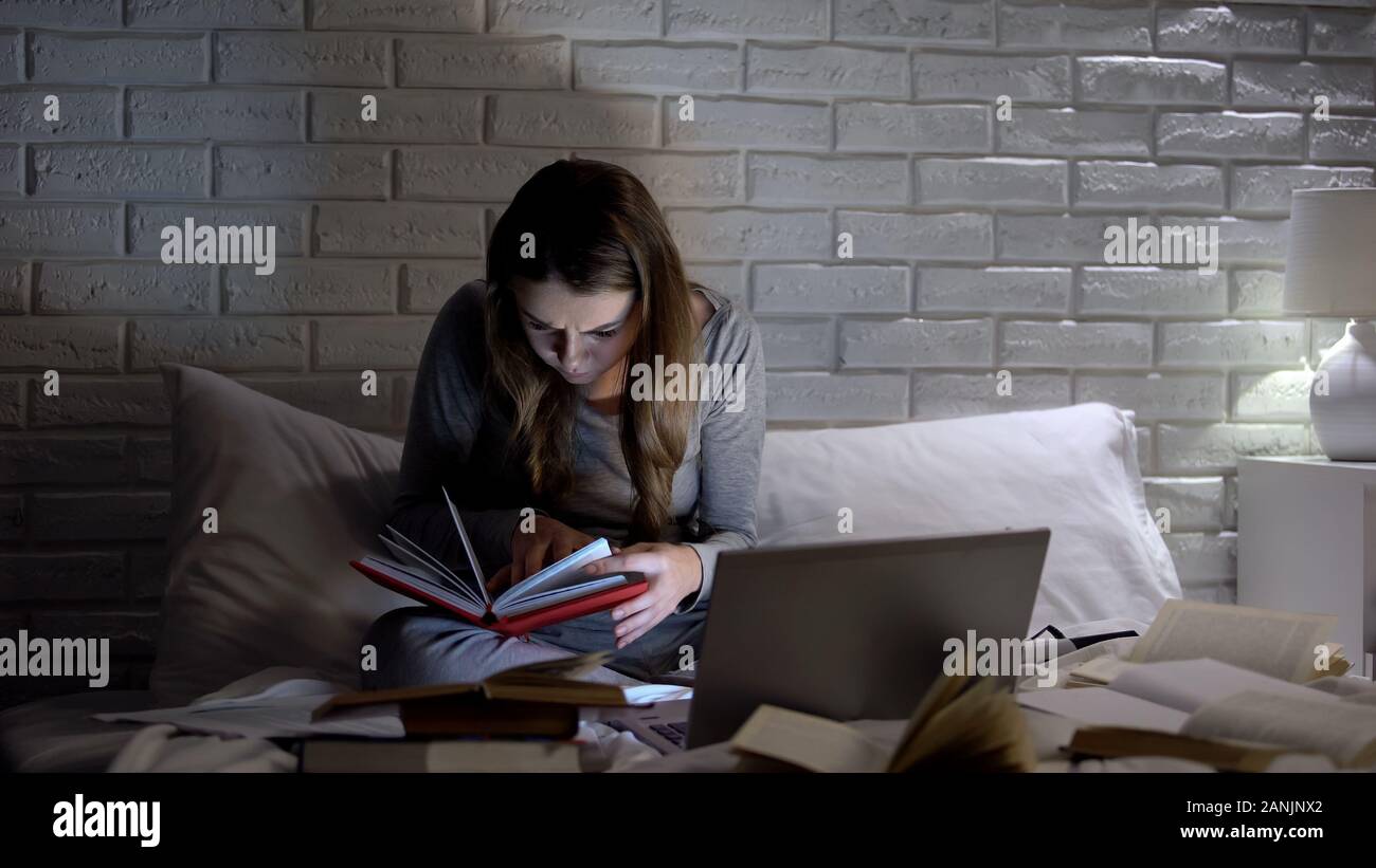 Female student studying night tired hi-res stock photography and images ...
