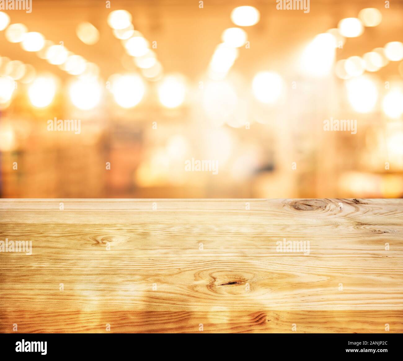 Wood texture table top (counter bar) with blur light gold bokeh in cafe ...