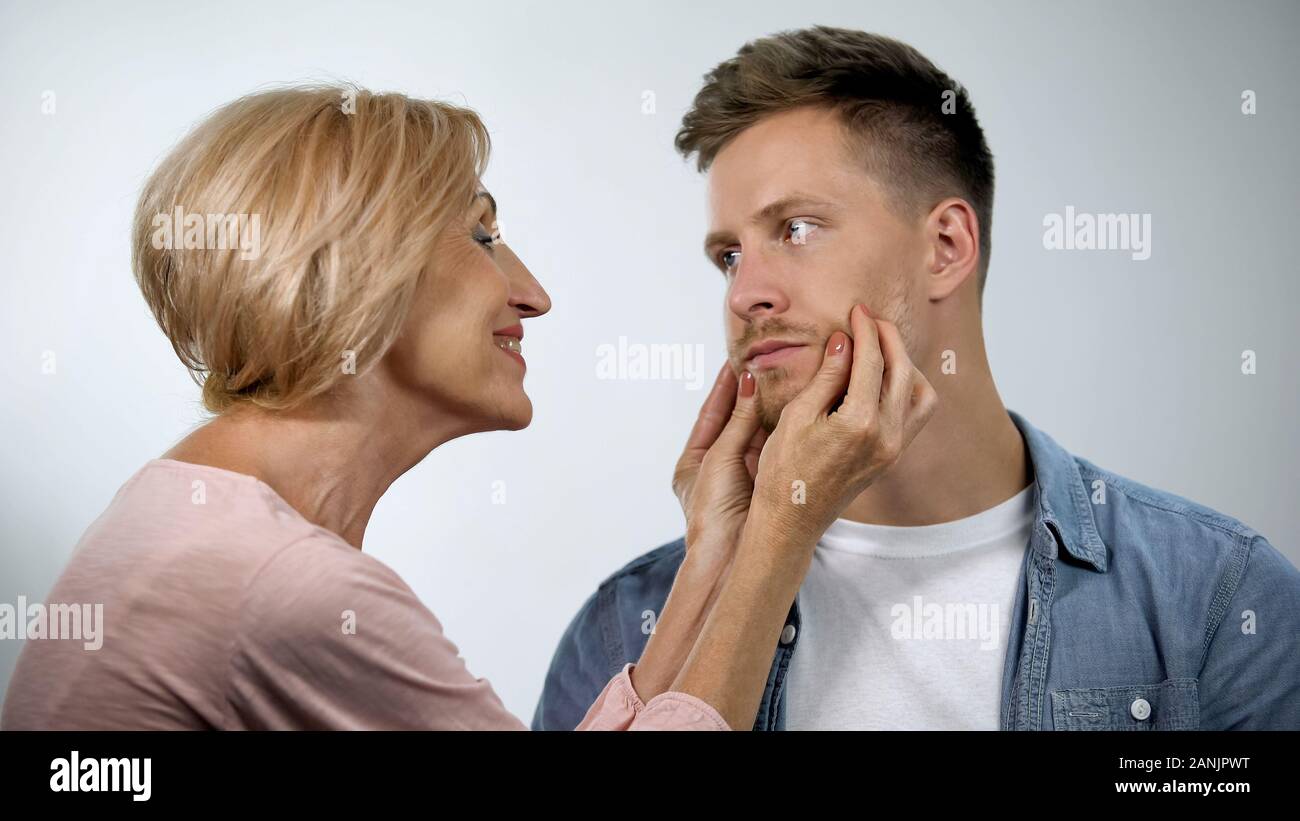 Pinching cheek hi-res stock photography and images - Alamy