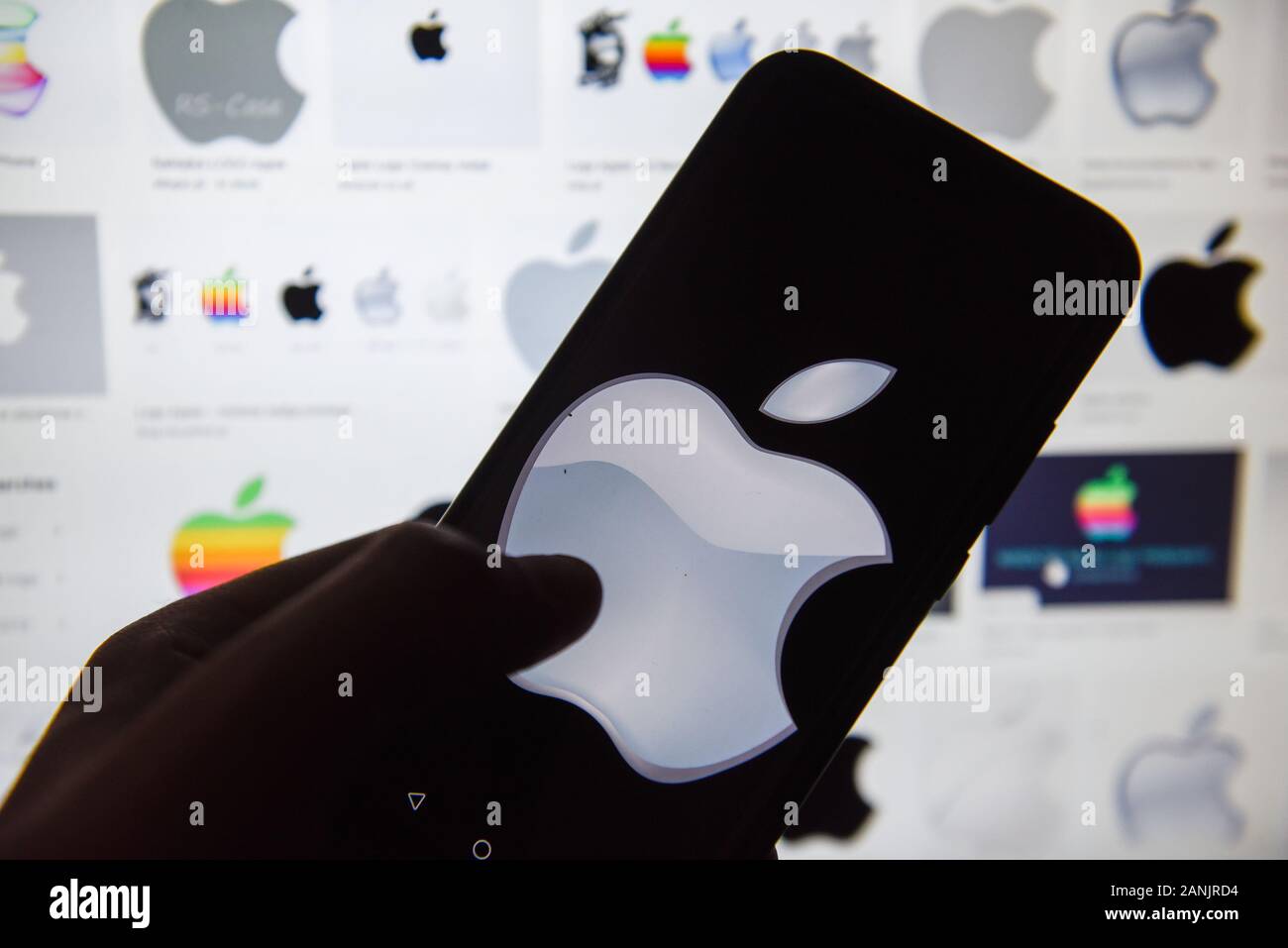 In this photo illustration an Apple logo displayed on a smartphone ...