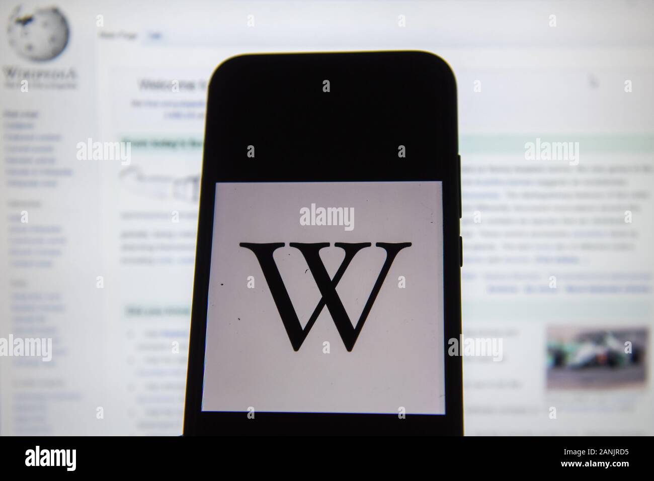 In this photo illustration a Wikipedia logo displayed on a smartphone ...