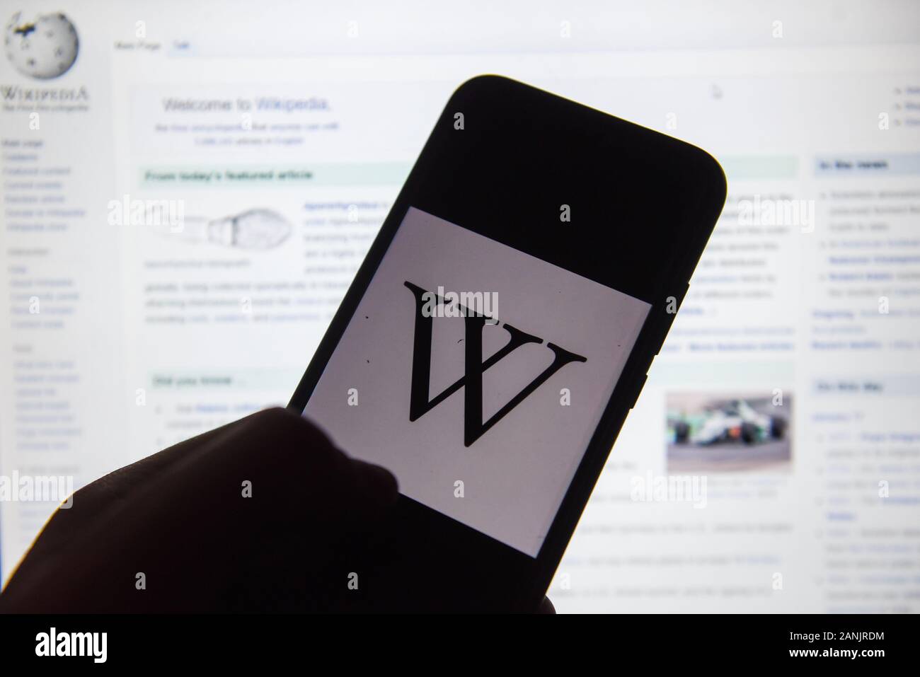 In this photo illustration a Wikipedia logo displayed on a smartphone ...