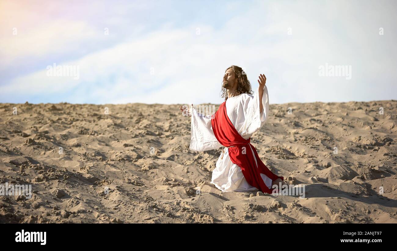 Man in robe kneeling hi-res stock photography and images - Alamy