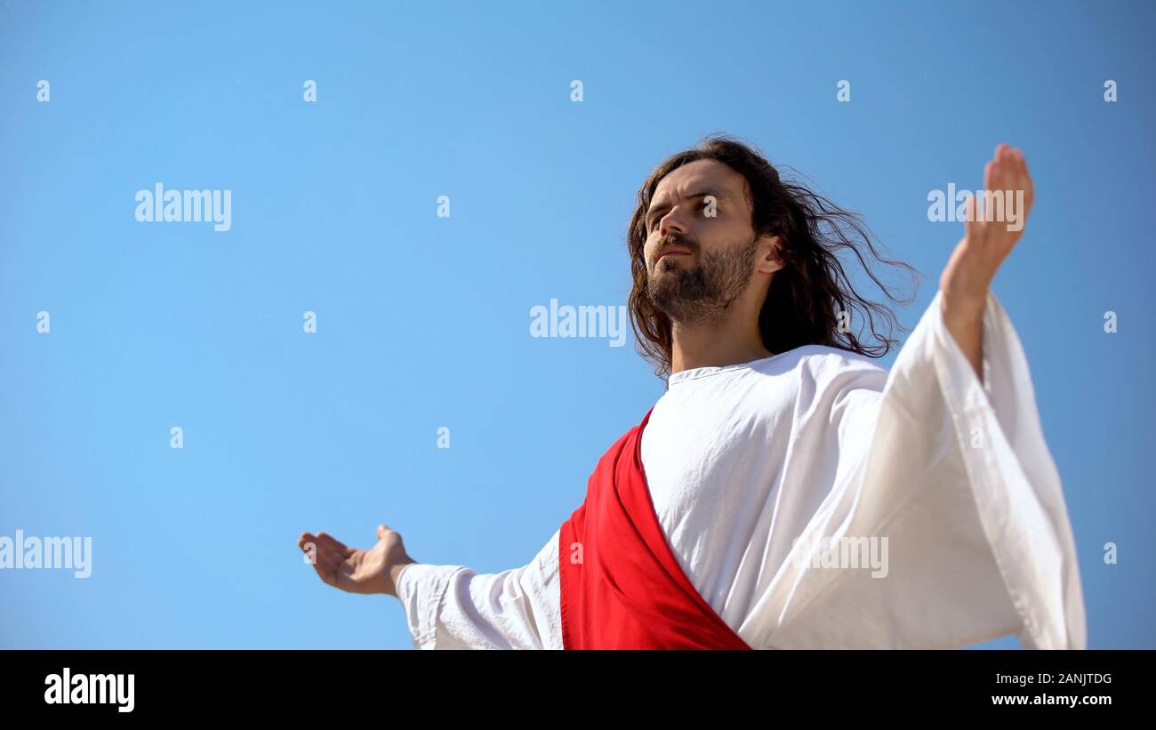 Saint man looking at sky with opened hands, Jesus resurrection and ...