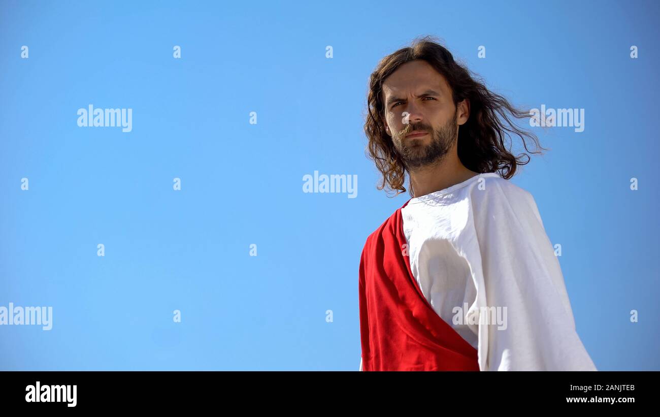 Saint man looking into camera from above, template for religious ...