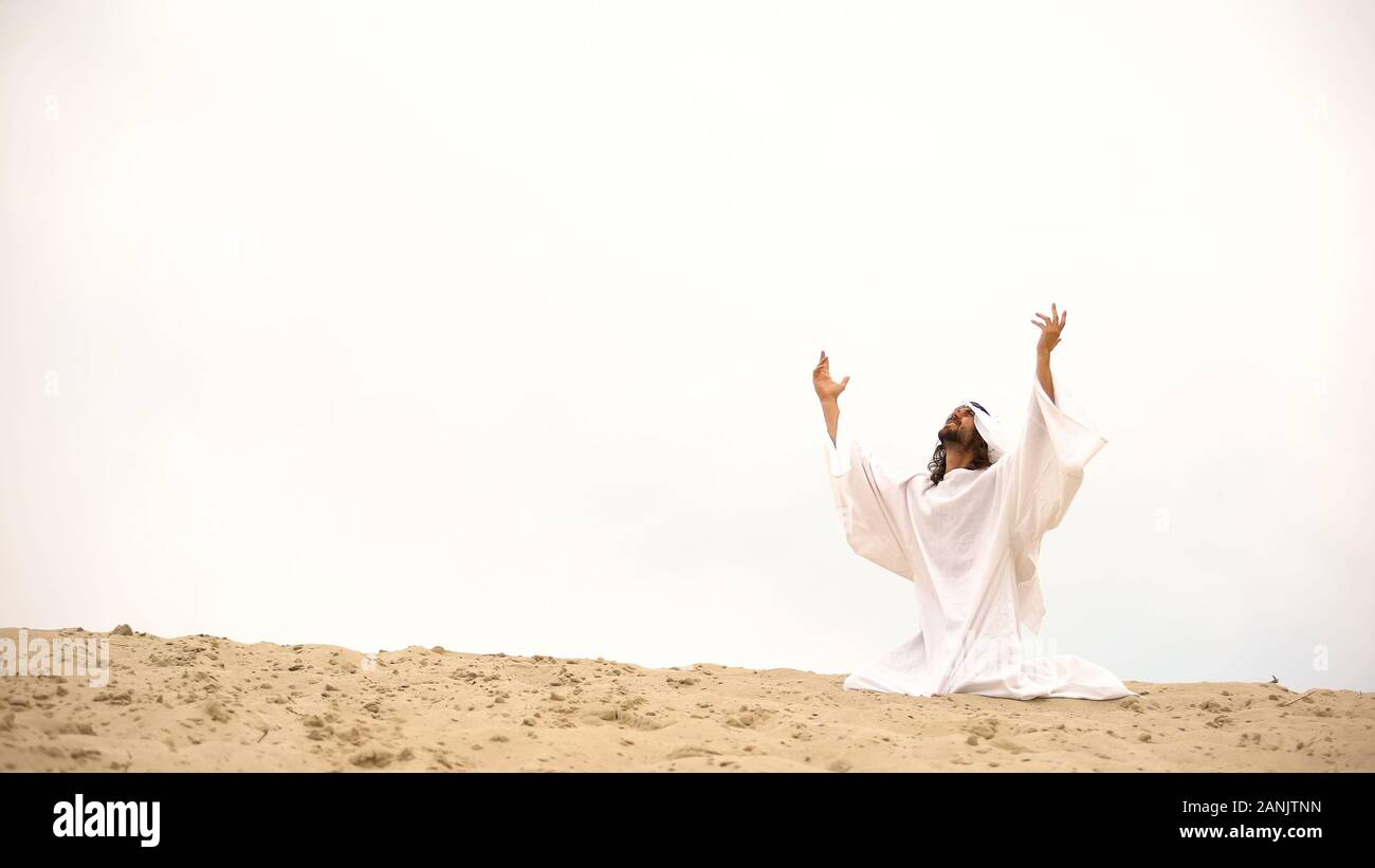 Praying on knees hi-res stock photography and images - Alamy