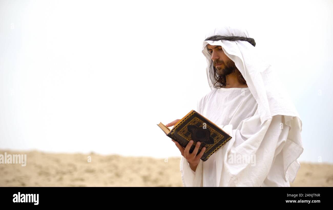 Arab man praying in desert hi-res stock photography and images - Alamy