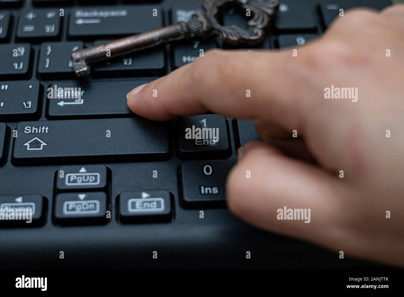 Close up female Index finger push button Enter on the computer keyboard ...