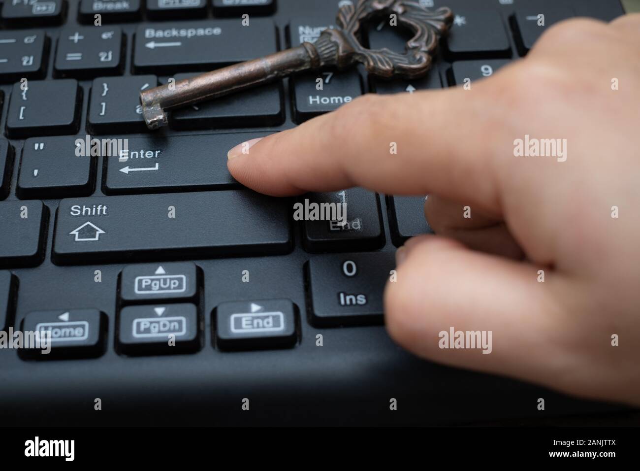 Close up female Index finger push button Enter on the computer keyboard ...