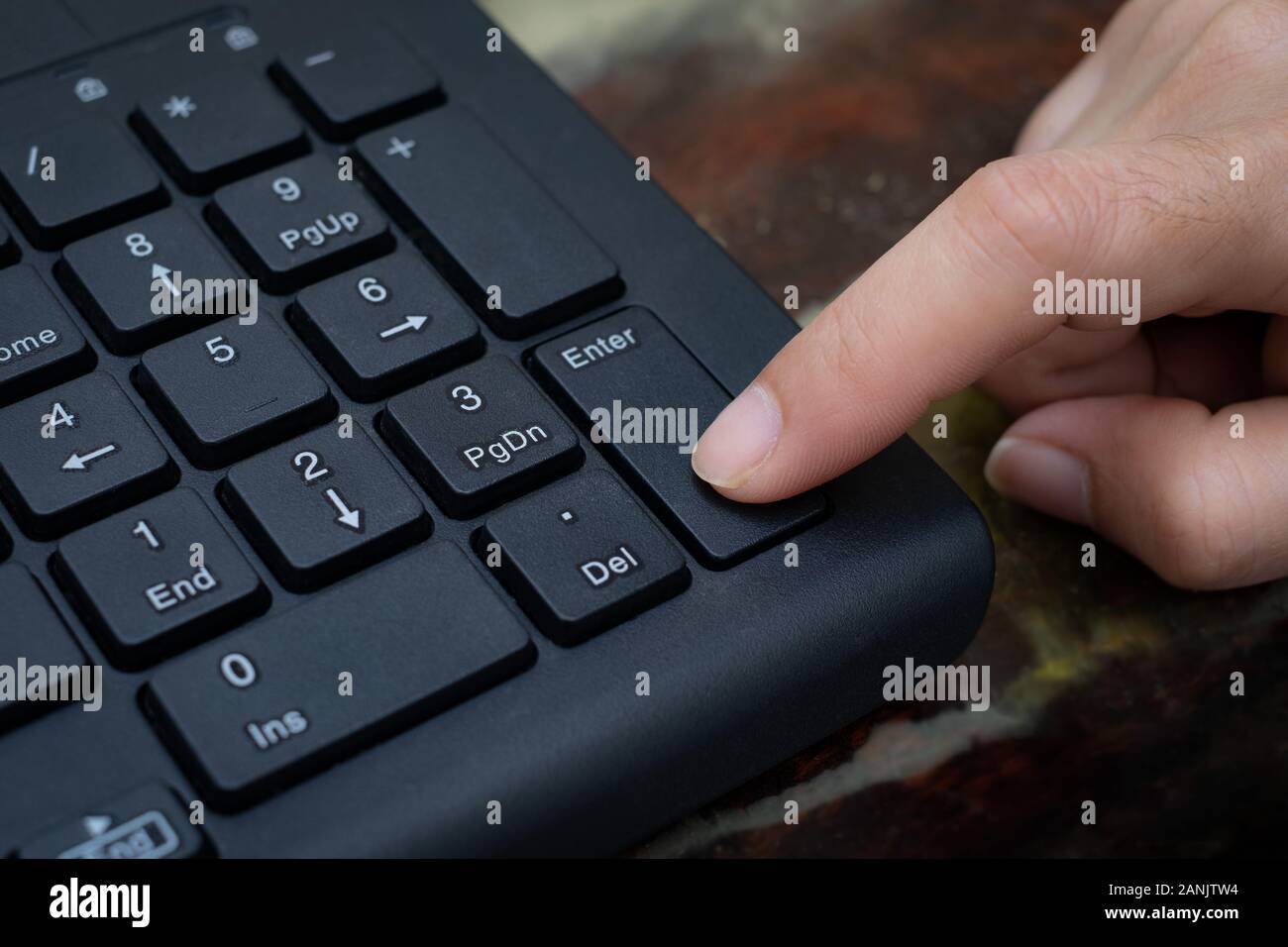 Close up Index finger push button Enter on the computer keyboard Stock ...