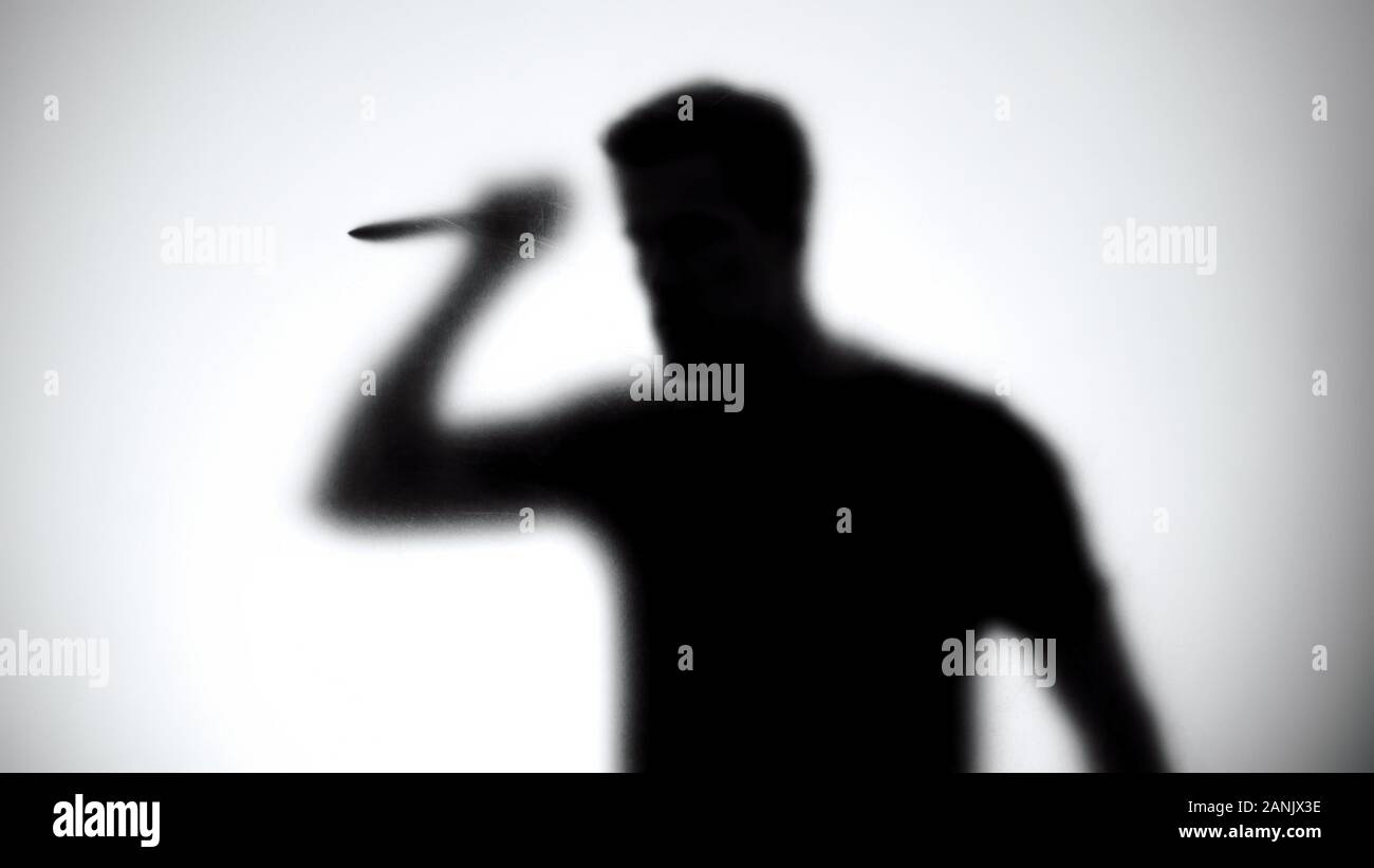 Man holding knife silhouette hi-res stock photography and images - Alamy