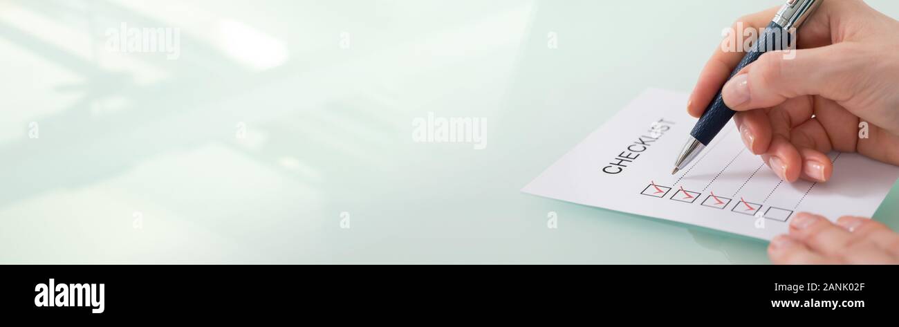 Close-up Of Female Hand Marking On Checklist Form With Red Pen Stock ...