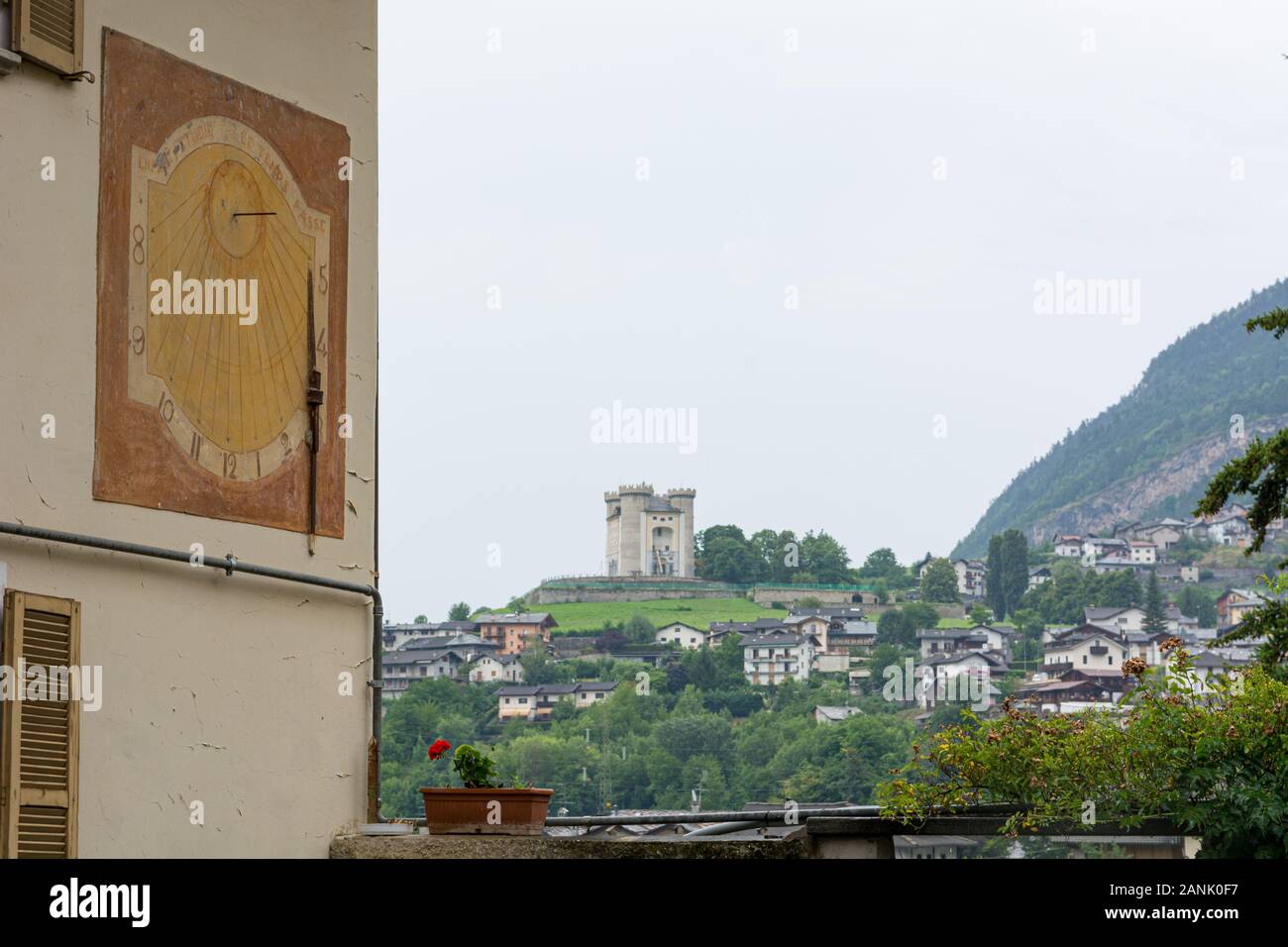 Old sun clock painted on a building wall Stock Photo - Alamy
