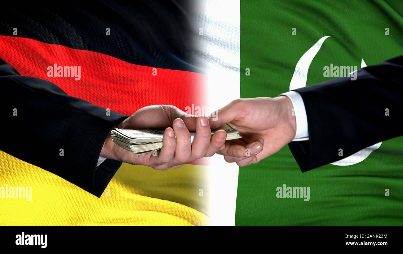 Germany and Pakistan officials exchanging money, flag background ...