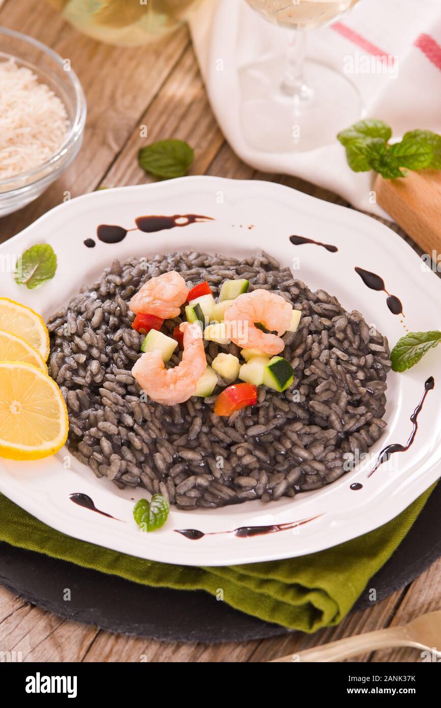 Squid ink risotto Stock Photo - Alamy