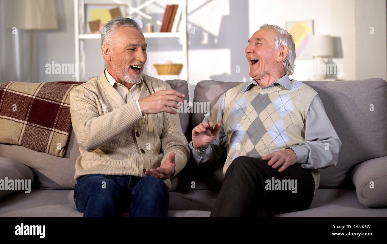 Old friends laughing together hi-res stock photography and images - Alamy