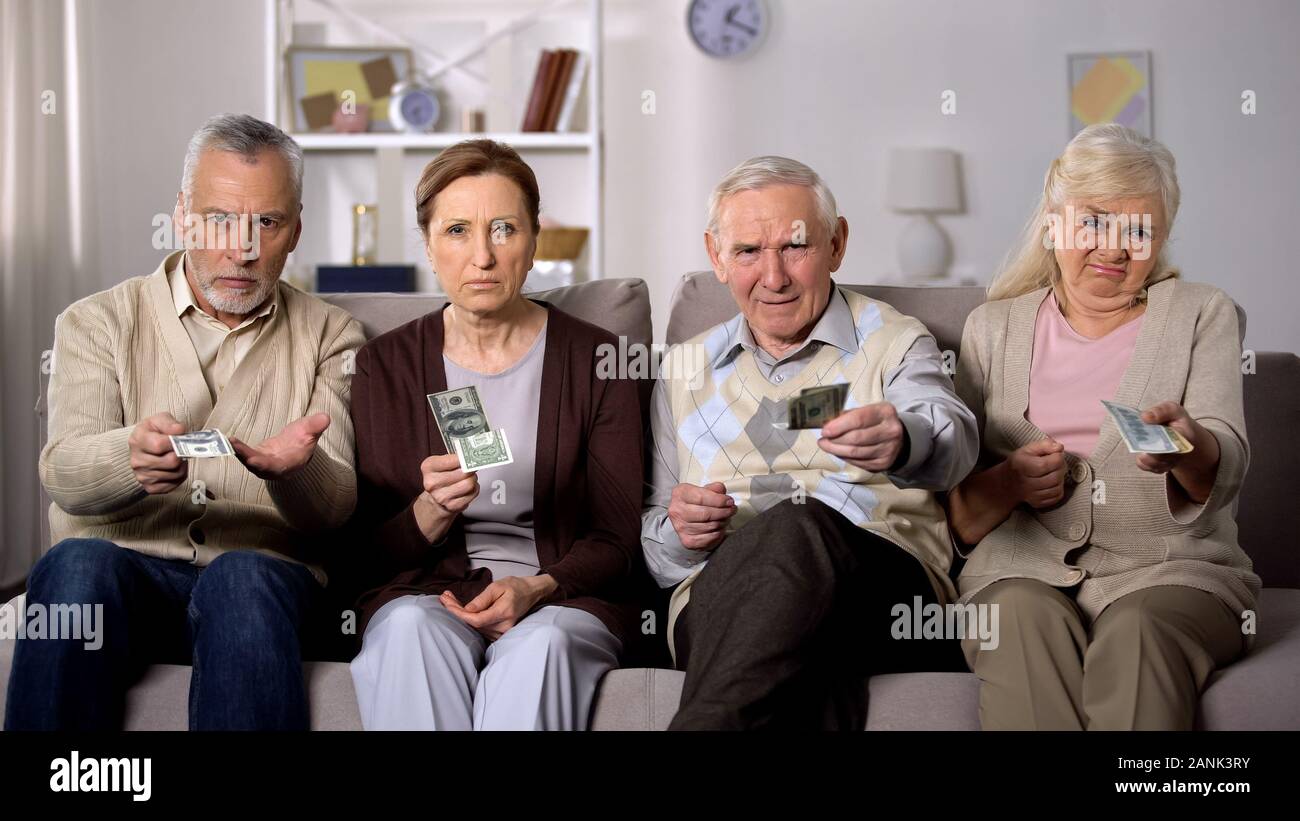 Poor people holding dollars, demanding money, upset with pension social ...