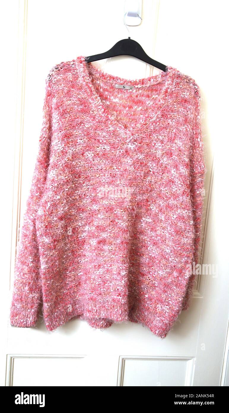 Pink v neck sweater hi-res stock photography and images - Alamy