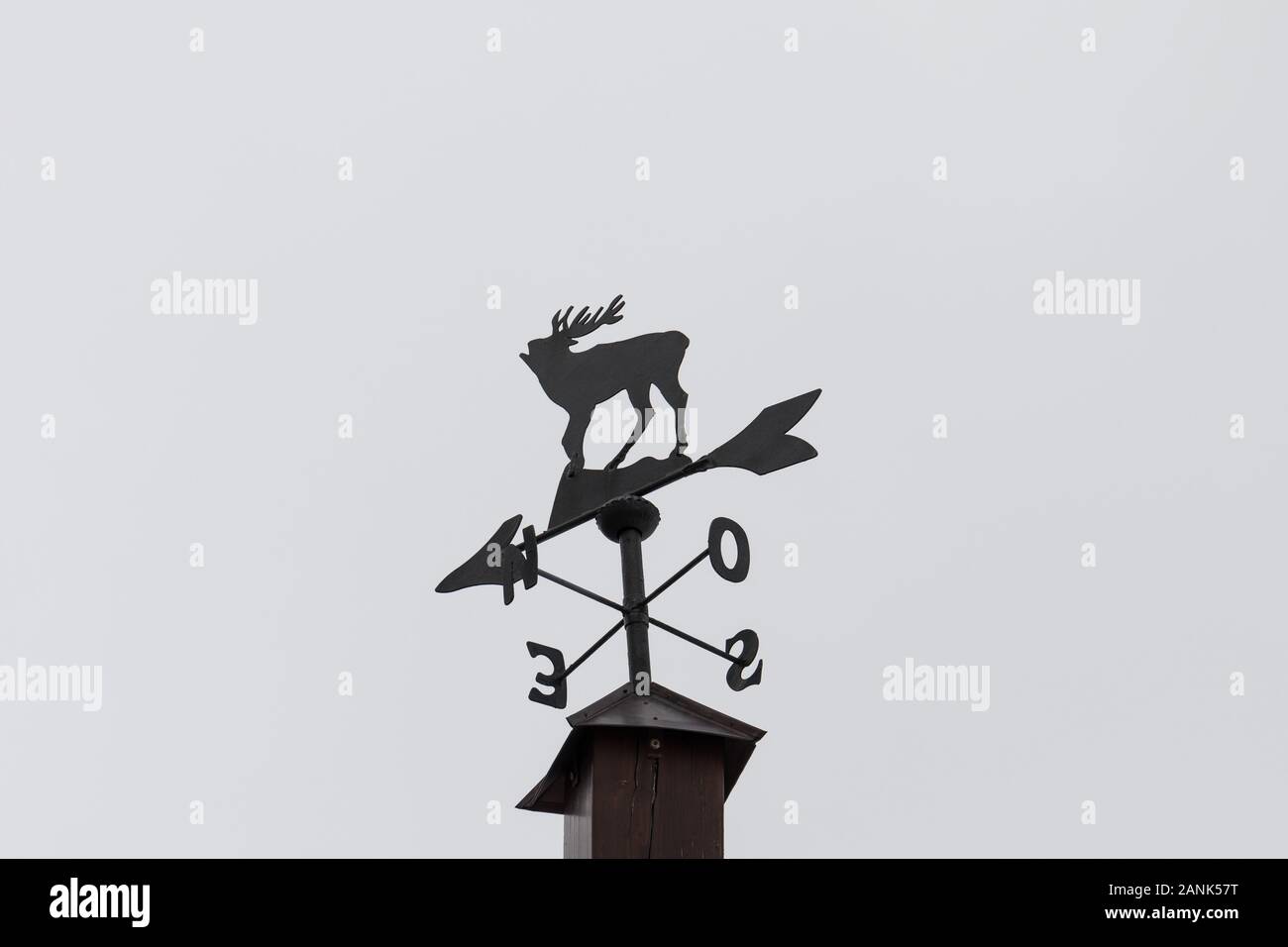Weathervane with deer silhouette Stock Photo - Alamy