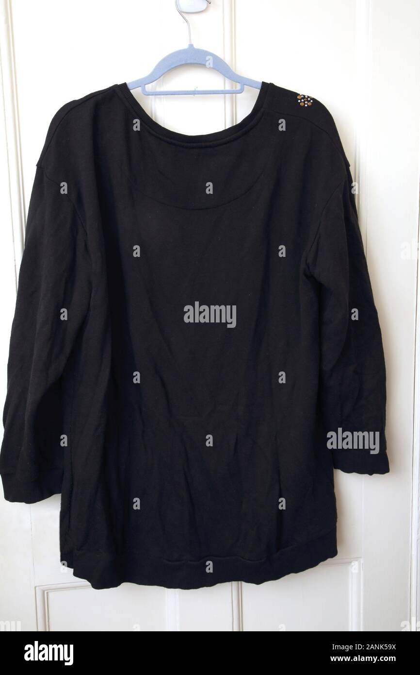 Back view of Long Black Jumper Stock Photo - Alamy