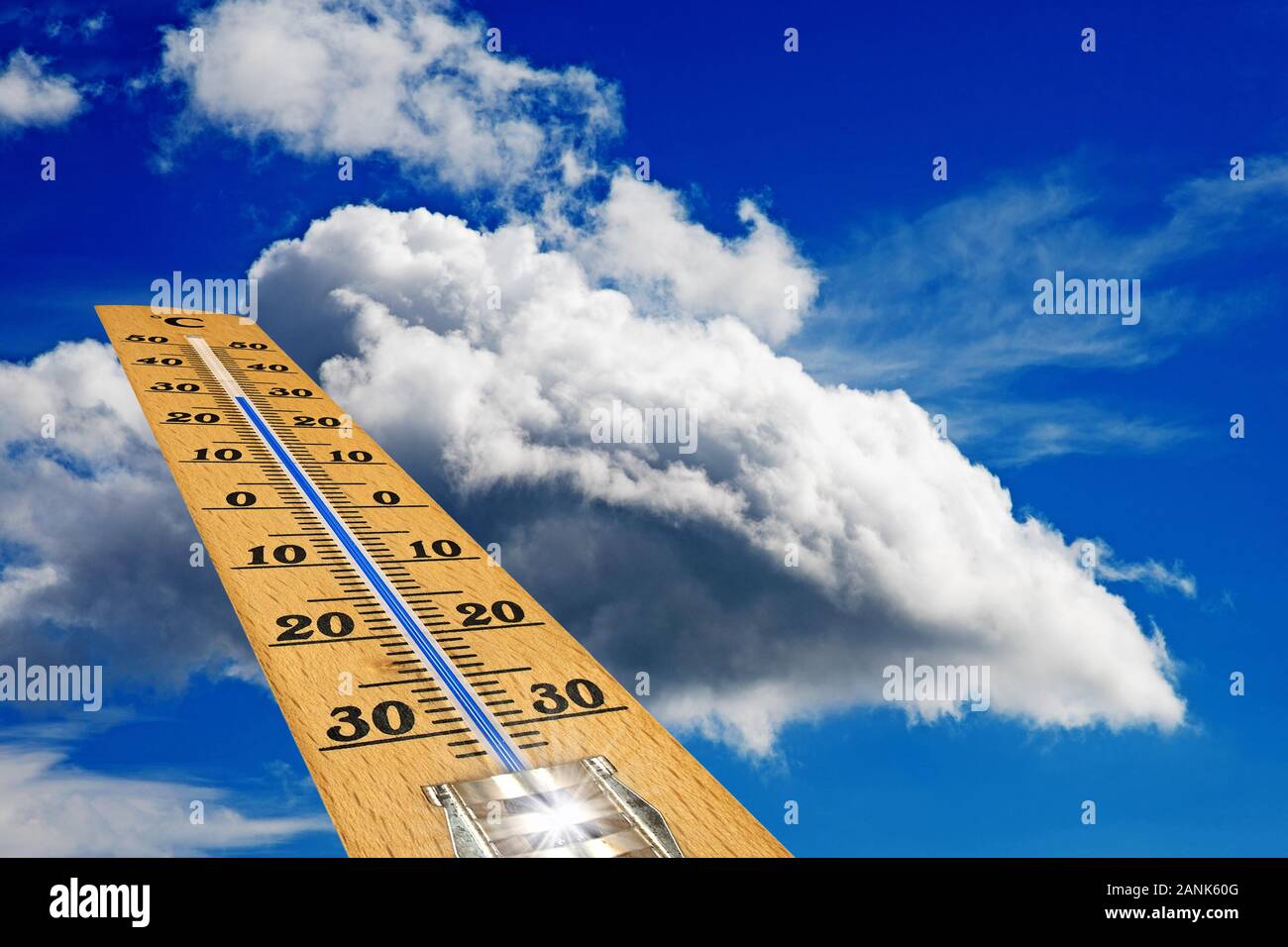 Thermometer in front of sky with clouds Stock Photo - Alamy