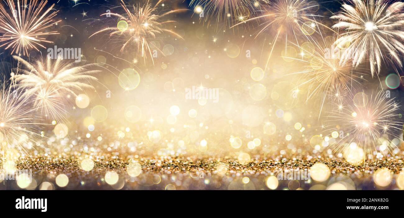Golden Glitter Background With Fireworks In The Night Stock Photo - Alamy