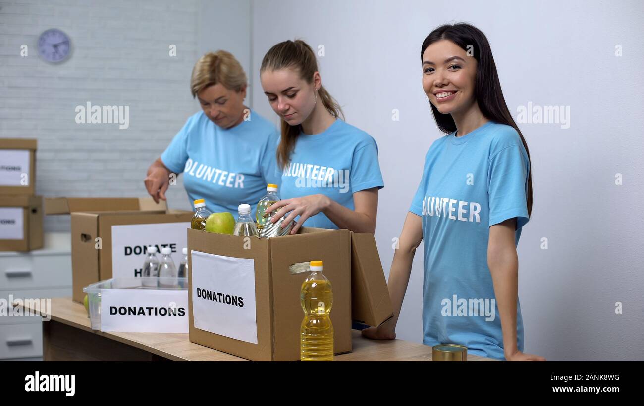 Donation boxes to homeless woman hi-res stock photography and images ...