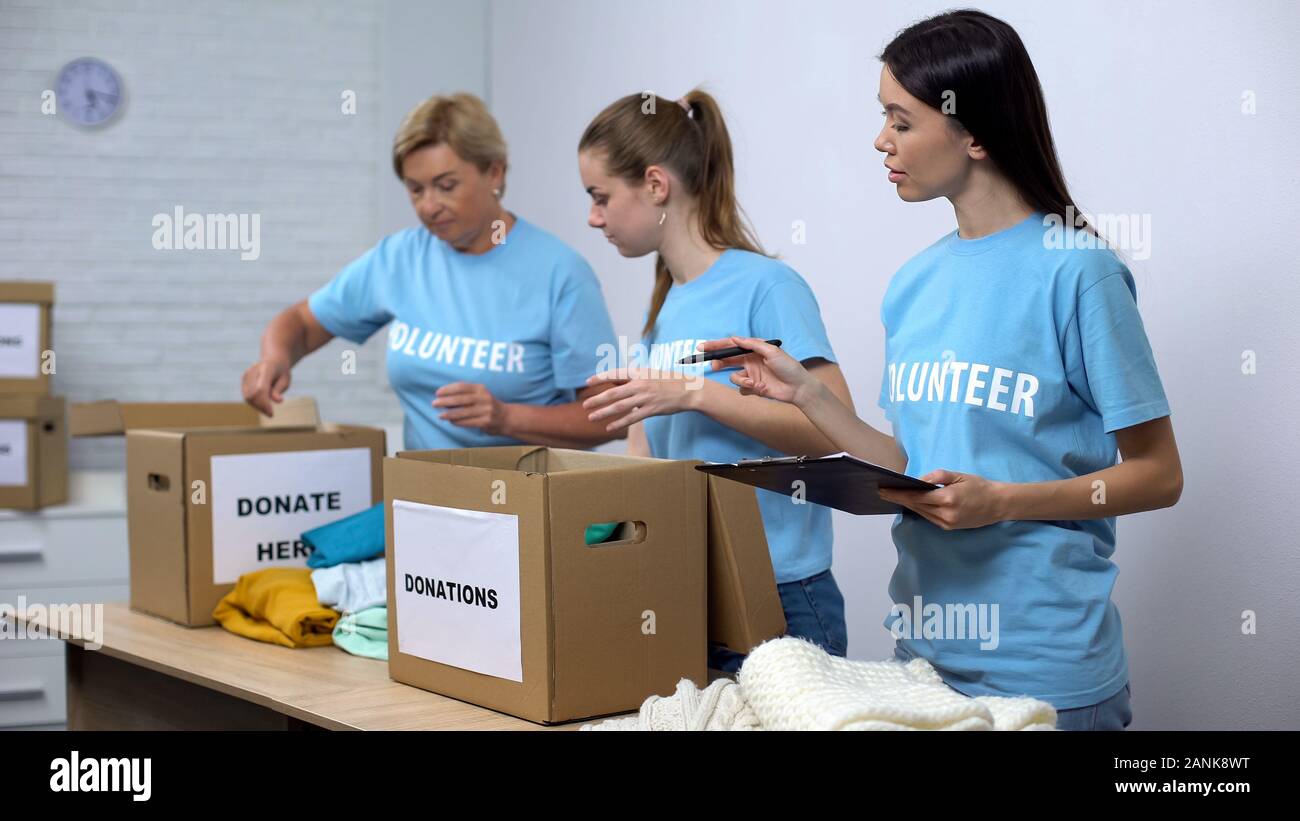 Donation boxes to homeless woman hi-res stock photography and images ...