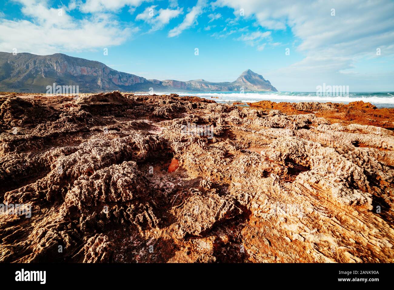 The unique shape of the volcanic beach in sunlight. Picturesque day and ...