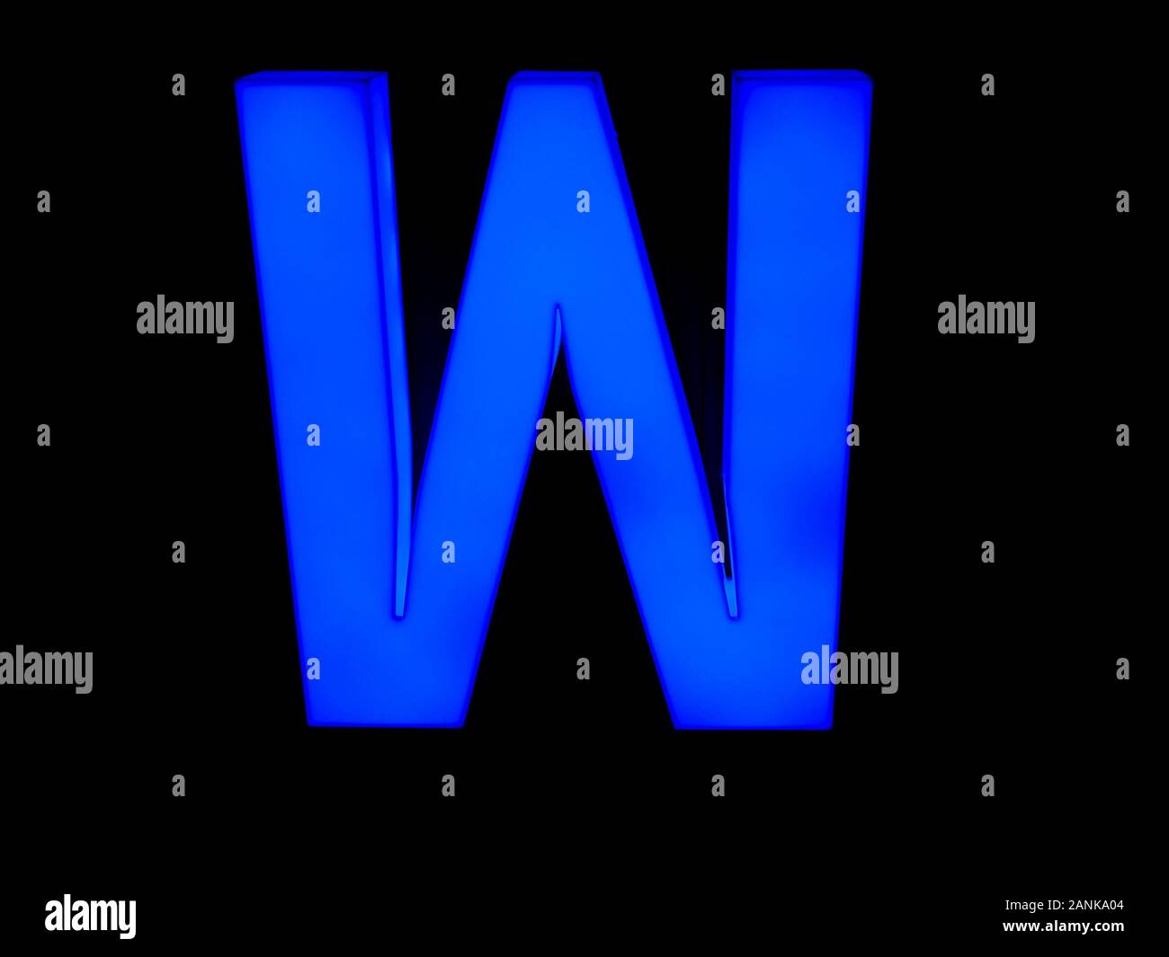 Blue neon light capital letter W over black background Stock Photo - Alamy