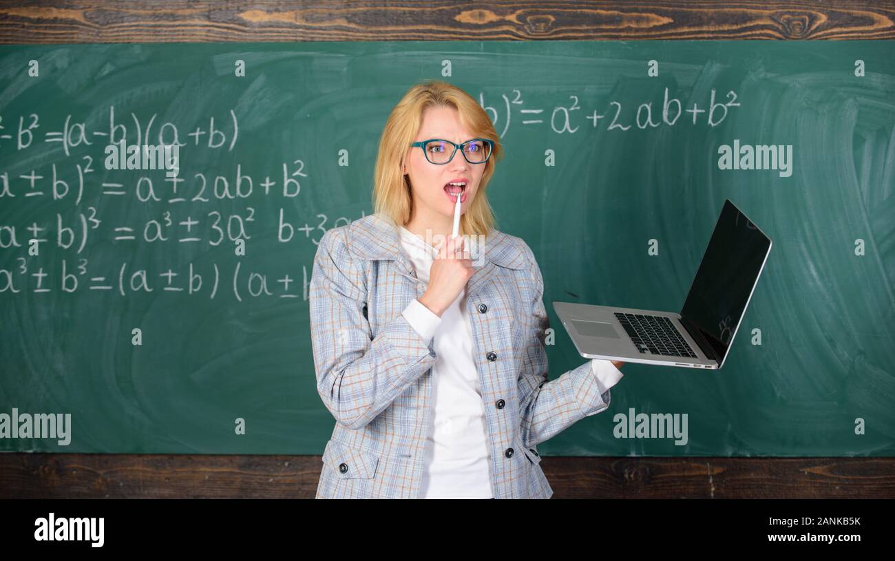 Educator smart clever lady with modern laptop surfing internet ...