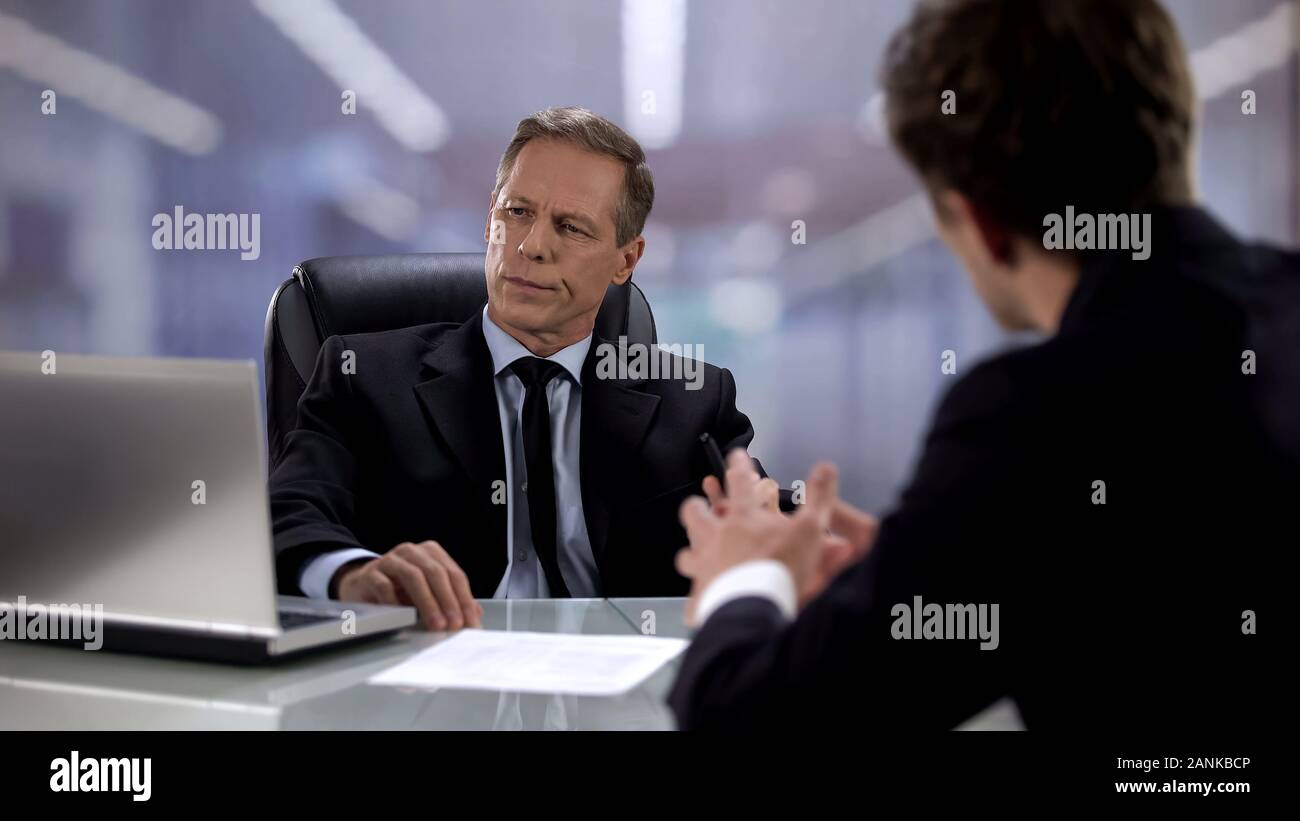 Male worker talking to arrogant boss ignoring him, opinion indifference ...