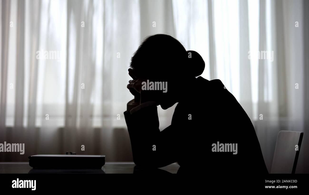 Woman thinking over laptop night hi-res stock photography and images ...