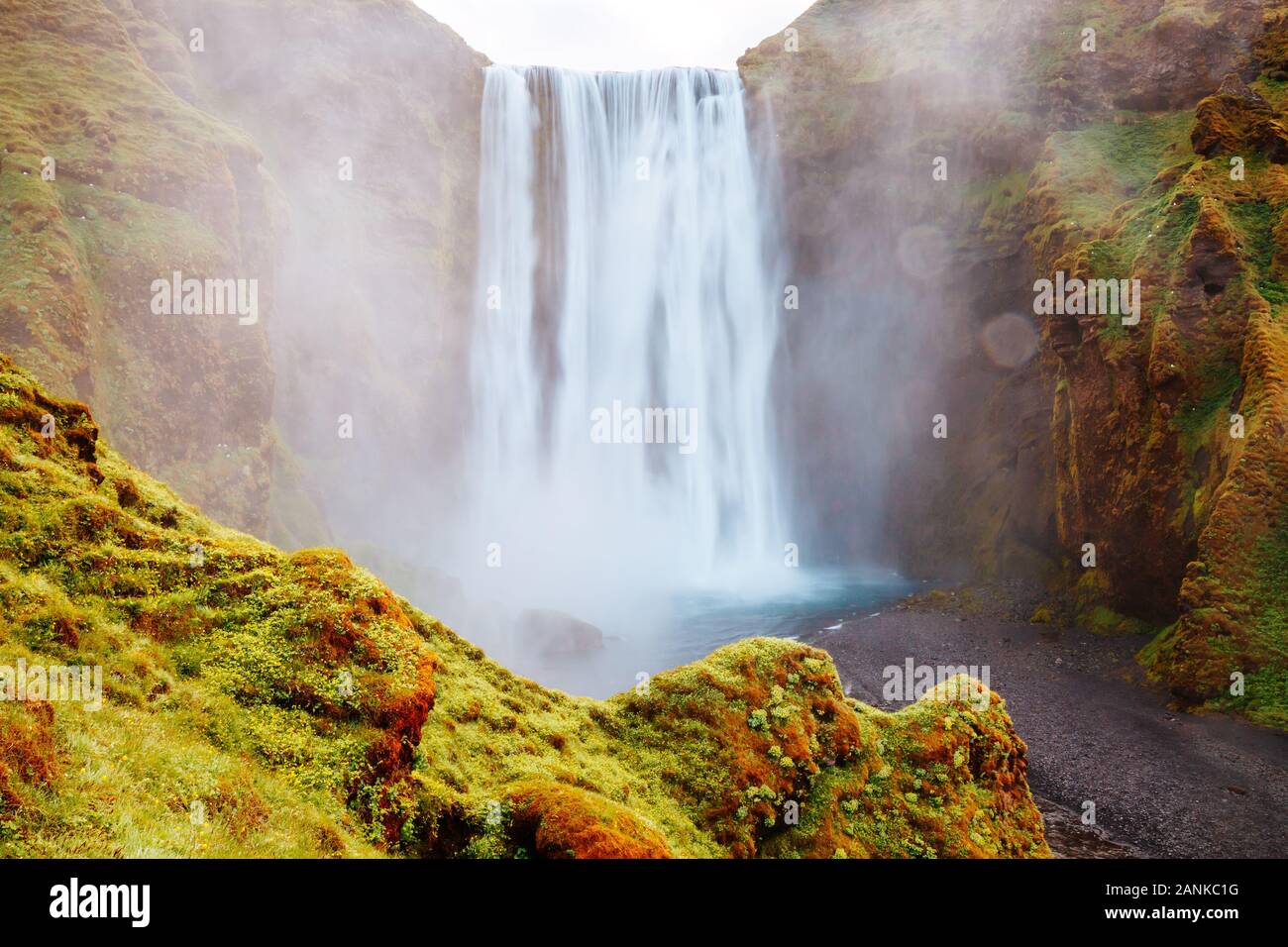 Lovely view of famous Skogafoss waterfall and scenic surroundings ...